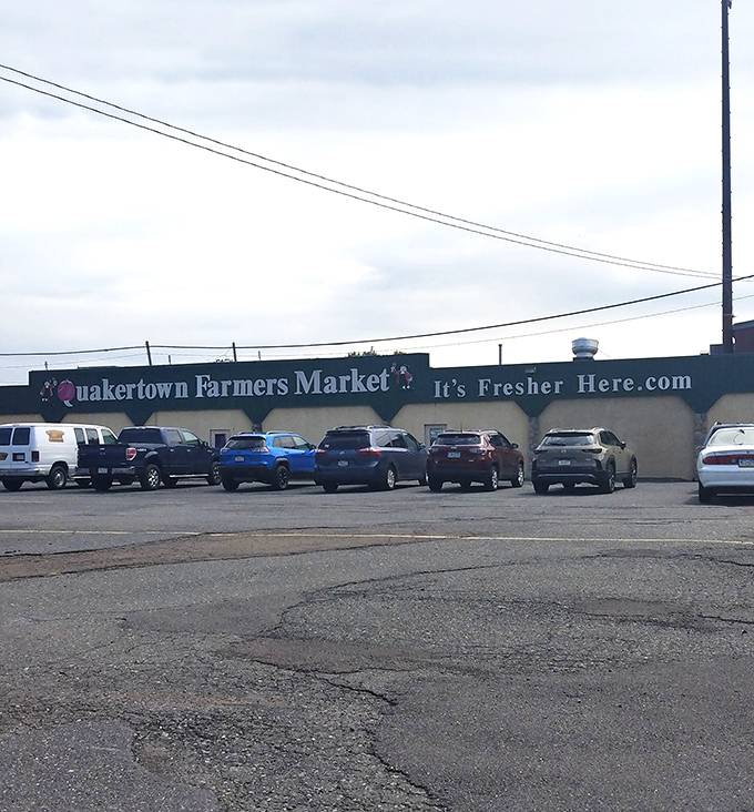 Rain or shine, the market's distinctive fa&ccedil;ade welcomes shoppers with its cheerful pink Q and promise of "It's Fresher Here."