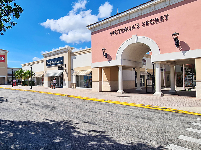 Victoria's Secret and Polo Ralph Lauren stand like retail royalty, beckoning shoppers with promises of discounted luxury.