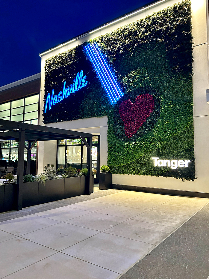 Nature meets neon in this stunning living wall display. The illuminated guitar silhouette reminds you you're still in Music City, even while hunting deals.