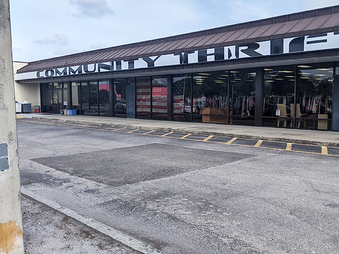 The storefront stretches longer than my patience at the DMV, promising endless aisles of possibility behind those reflective windows.