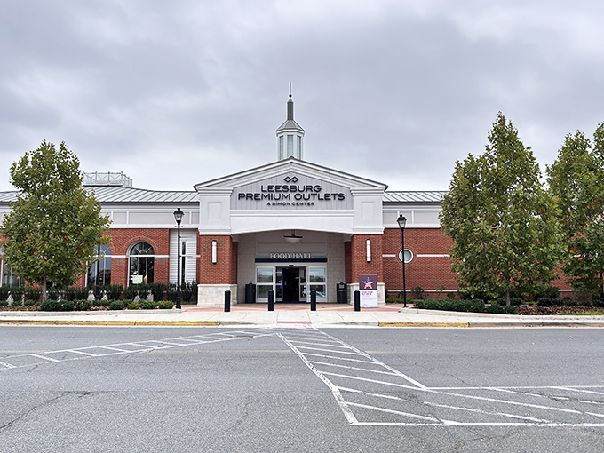 Colonial-inspired elegance meets modern shopping at the main entrance. Even the clouds seem to hover in anticipation of the deals inside.