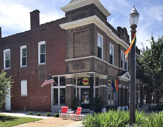 The American flag and Pride flag flutter outside, signaling that vintage style and inclusive values make perfect neighbors at this St. Louis gem.