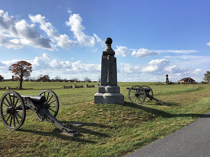 History stands sentinel across Gettysburg's hallowed fields, where monuments and cannons mark the spots where ordinary Americans made extraordinary sacrifices.