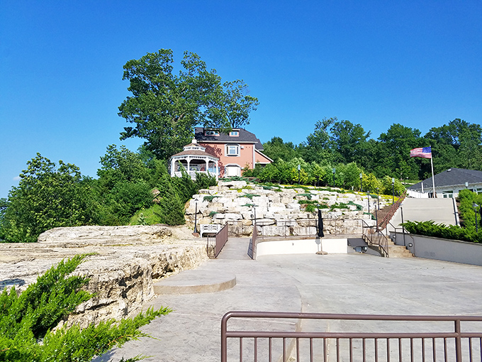 Perched above limestone terraces, this charming home with its white gazebo offers retirement with a view. Missouri's rolling hills create a backdrop worthy of daily admiration.