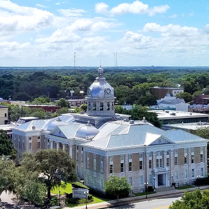 The iconic silver dome of Bartow's historic courthouse stands sentinel over a sea of green, reminding visitors that affordable living doesn't mean sacrificing beauty.