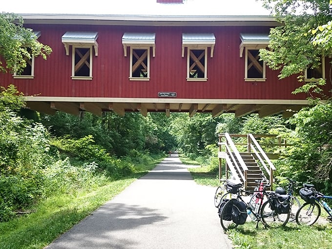 The red covered bridge spanning the bike path offers a picture-perfect moment. Like something from a storybook, it invites cyclists to pause and appreciate.