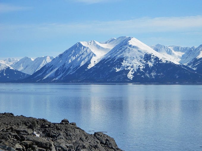 Mirror-perfect waters reflect snow-capped peaks like nature's own Instagram filter. The Chugach Mountains showing off their good side&mdash;which happens to be all sides.