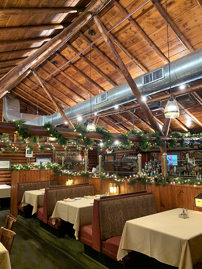 Vaulted wooden ceilings soar above diners, with exposed beams and twinkling lights creating the perfect atmosphere for both celebration and intimate conversation.