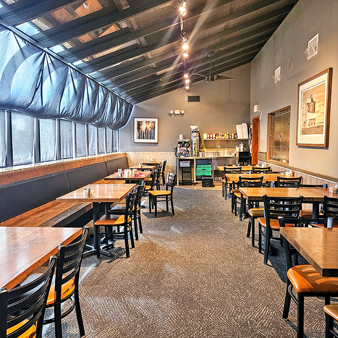 Simple wooden tables, practical chairs, and zero pretension—this dining room knows exactly what it is: a temple dedicated to the worship of breakfast.