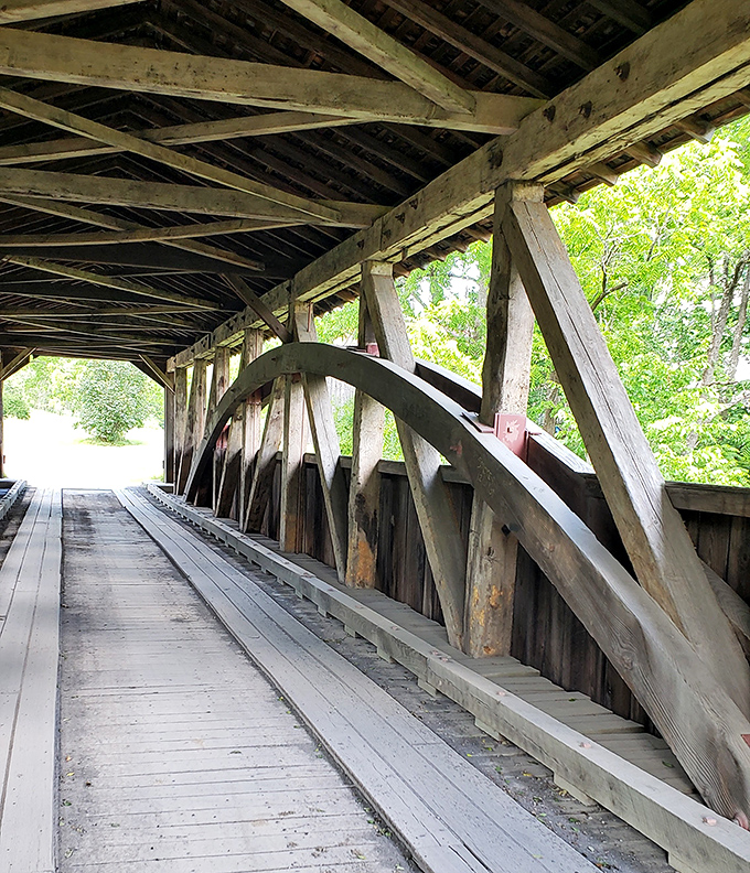 Step inside and you're walking through a wooden cathedral of craftsmanship. The intricate truss system overhead tells stories of engineering ingenuity from another era.