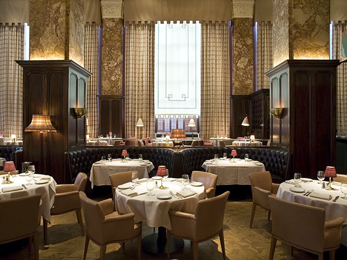 Soaring ceilings, marble columns, and plush seating create a dining room straight out of Hollywood's golden age. Sinatra would feel right at home here.