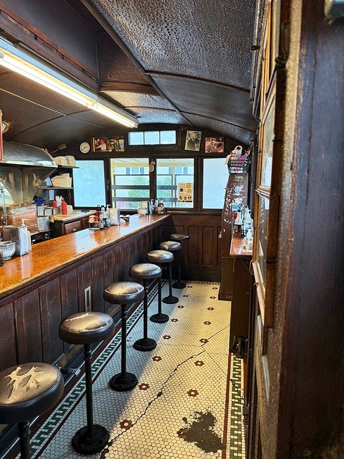 Step inside and travel back in time. This narrow counter with its worn stools has witnessed countless conversations and comfort food moments.