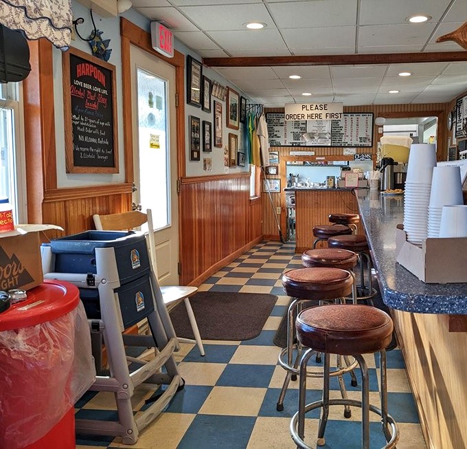 Classic New England charm meets seafood perfection at the counter. Those stools have supported generations of happy clam enthusiasts.