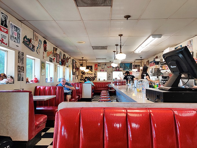 Classic red vinyl booths and checkerboard floors transport you to a time when conversations happened face-to-face and smartphones were science fiction.