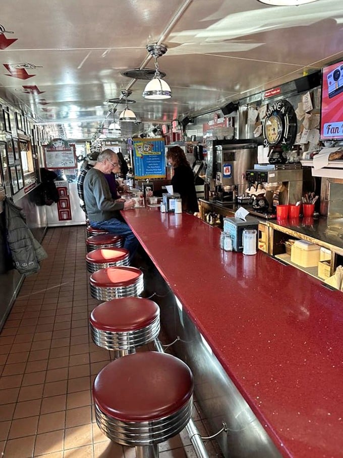 Counter culture at its finest! The gleaming red counter and chrome stools aren't just seating&mdash;they're front-row tickets to the greatest breakfast show on earth.