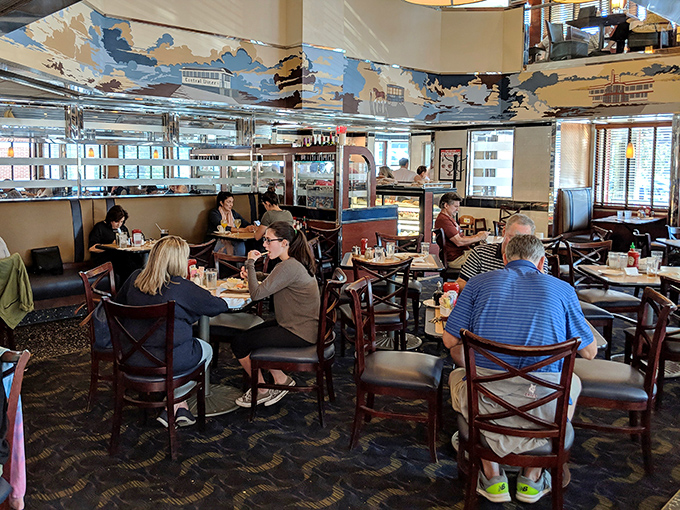 Inside, murals dance across the walls while diners engage in the sacred ritual of deciding between pancakes and omelets. Life's toughest decisions happen here.