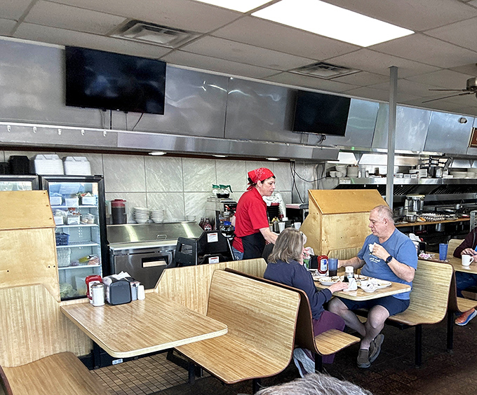 Where breakfast dreams come true! The open kitchen design lets you witness the morning magic while wood-paneled booths offer that classic diner comfort.
