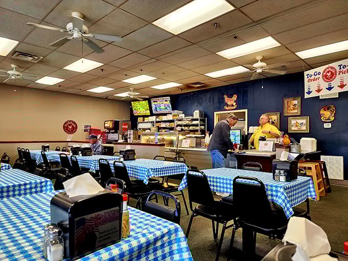 Blue checkered tablecloths and no-nonsense seating tell you immediately: this place prioritizes what's on your plate, not what's on the walls.
