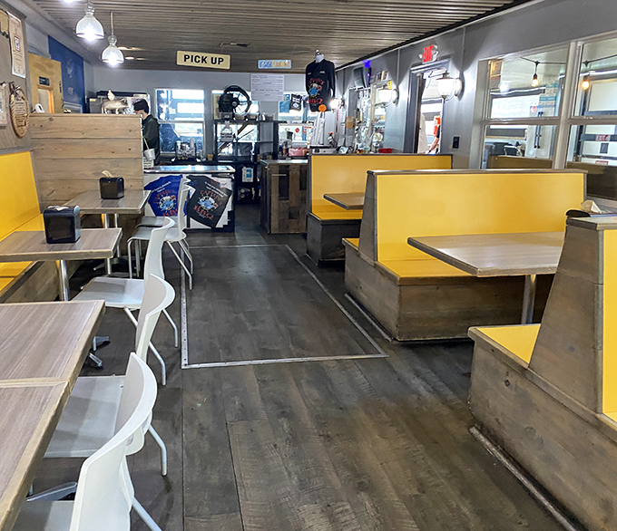 No white tablecloths here, just yellow booths and honest intentions. The simple interior lets you focus on what matters—the smoky masterpieces about to grace your plate.