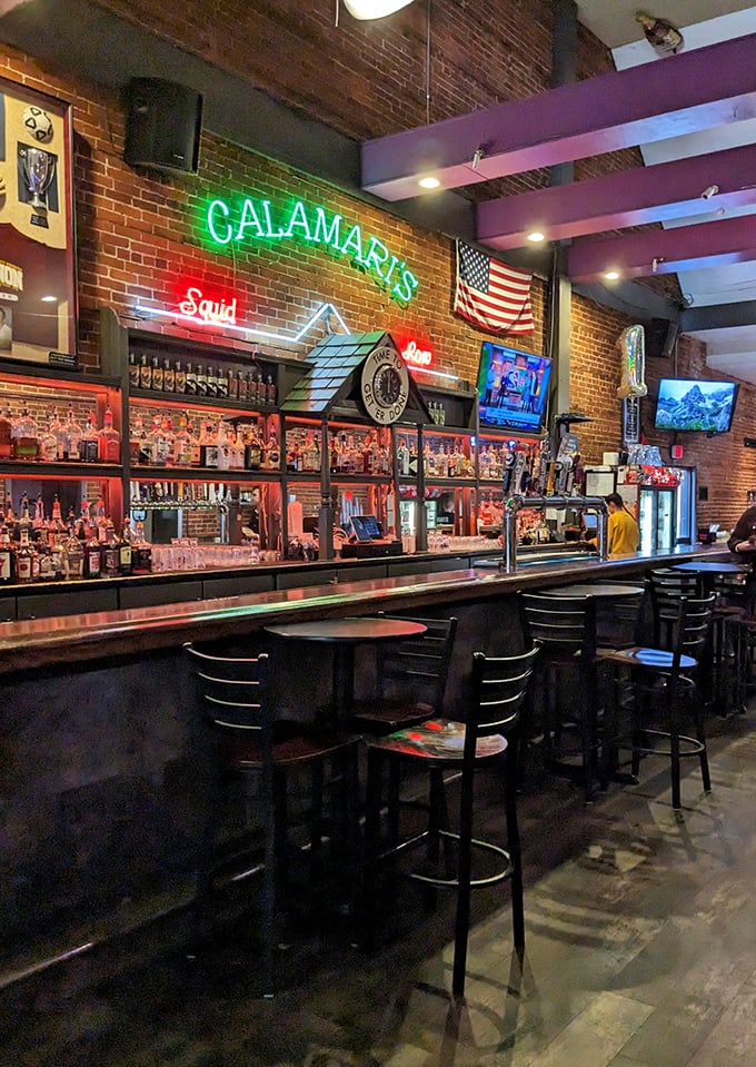 The neon glow of "Calamari's Squid Row" illuminates decades of good times. This bar doesn't just serve drinks&mdash;it serves memories.