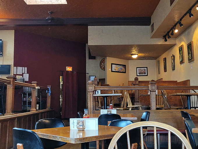 Multi-level seating creates cozy nooks throughout the interior, where wooden accents and warm lighting make everyone look like they're having the time of their life.