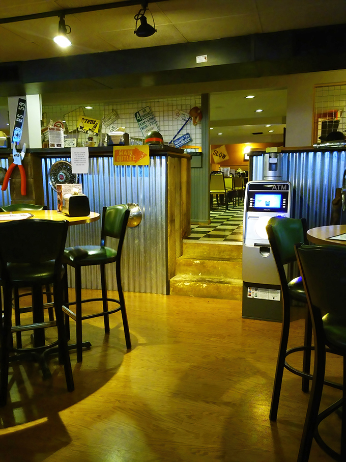 Step inside and the corrugated metal meets checkered floor aesthetic tells you this place prioritizes flavor over frills.