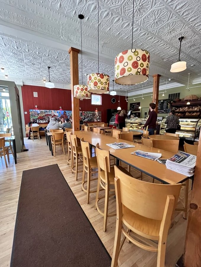 Ornate tin ceilings, warm wooden tables, and colorful pendant lights create that perfect "nonna's kitchen meets modern caf&eacute;" vibe that makes you want to linger all afternoon.