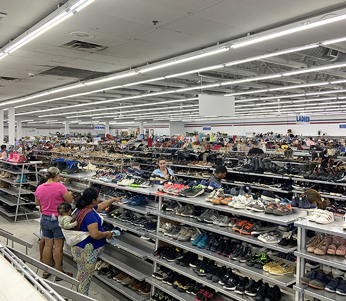A sea of shoes stretches toward the horizon, each pair with stories to tell and miles left to travel.