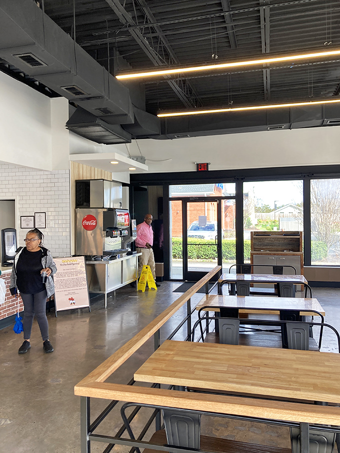 Industrial-chic meets Southern hospitality in this bright, airy space. The exposed ceiling and wooden tables create a modern backdrop for some seriously old-school flavor.
