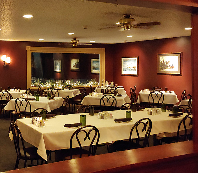 White tablecloths and warm lighting create the kind of dining room where time slows down and conversations deepen.