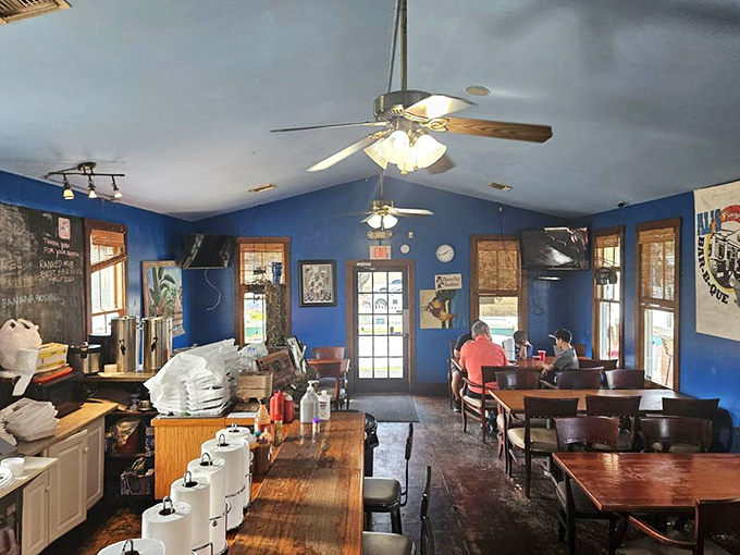 Inside, those vibrant blue walls aren't just a design choice&mdash;they're the perfect backdrop for the serious business of barbecue appreciation that happens daily.