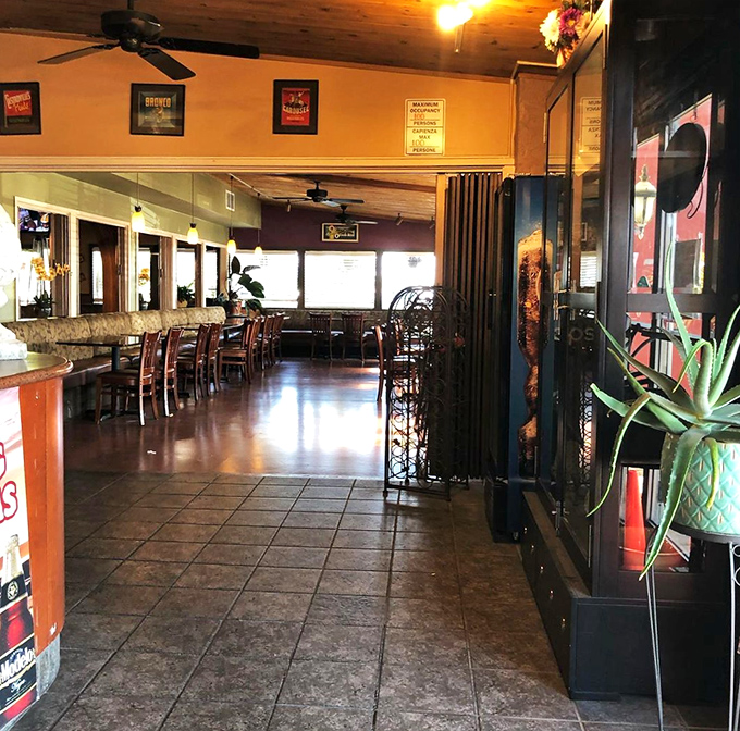 Step inside where ceiling fans spin lazily and artichoke adventures await at every cozy booth and table.