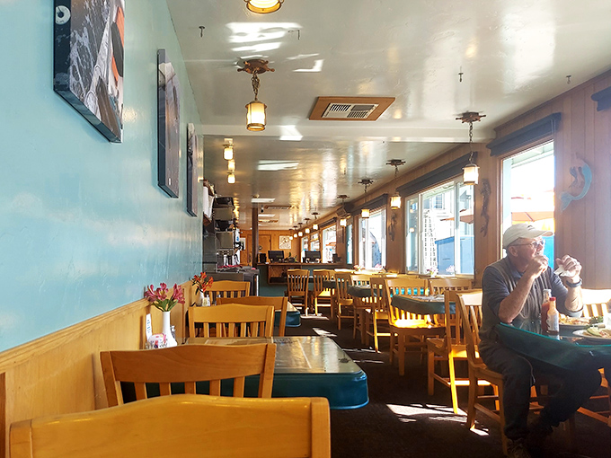 Simple wooden chairs and light blue walls create the casual vibe where nobody's rushing you through your meal. This is seafood therapy, not fast food.