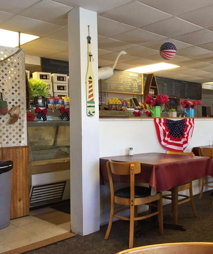 Simple tables, nautical decor, and patriotic touches create the perfect backdrop for seafood that needs no fancy setting to shine.