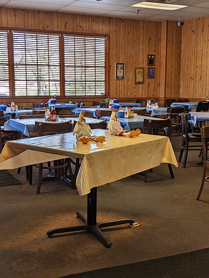 Wood paneling and checkered tablecloths create that perfect "grandma's dining room" vibe. No interior designer needed when the food is this good.