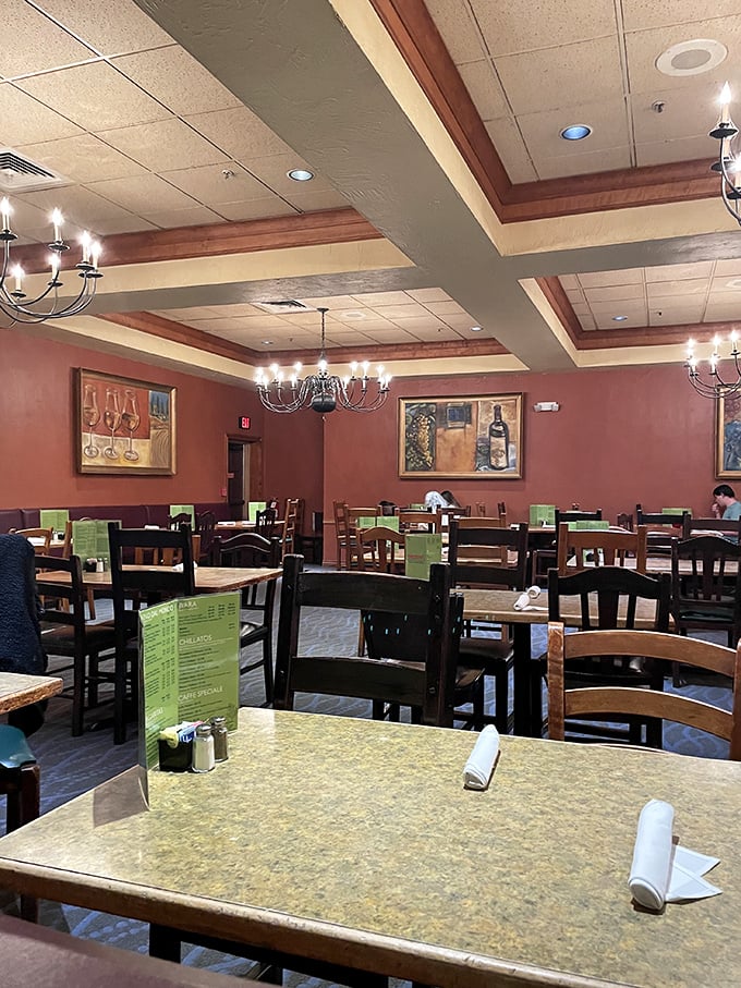 Warm terracotta walls, wooden accents, and Italian-inspired artwork create the perfect backdrop for the impending feast. Your stomach is already applauding.