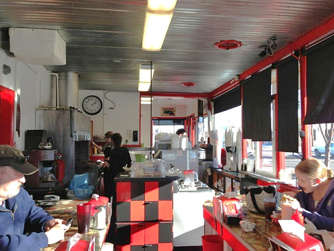 Where burger magic happens. The red and black checkerboard counter has witnessed decades of satisfied sighs and clean plates.