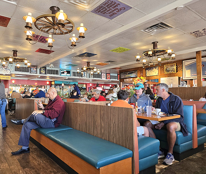 Wagon wheel chandeliers illuminate conversations between regulars who've been solving the world's problems over coffee for decades.