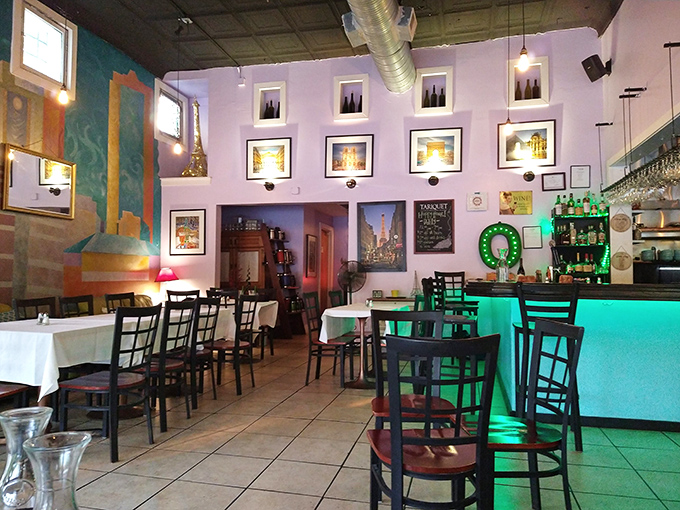 Colorful walls adorned with local artwork create an eclectic, artsy vibe that feels both sophisticated and comfortably casual.