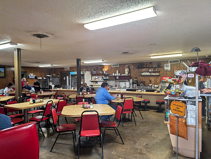 Inside Dun Bar East, red vinyl chairs and wood-paneled walls create the perfect time capsule where conversations flow as freely as the coffee.