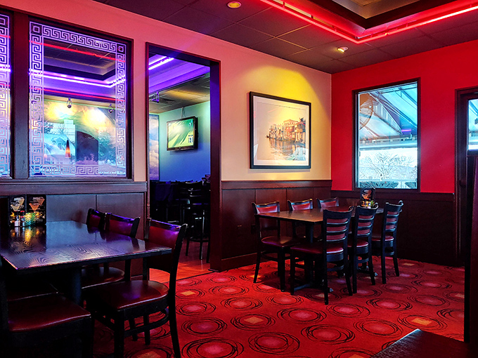 Step inside Kyma's dining room where red walls, mood lighting, and Greek-inspired decor transport you from Pennsylvania to the Mediterranean in seconds flat.