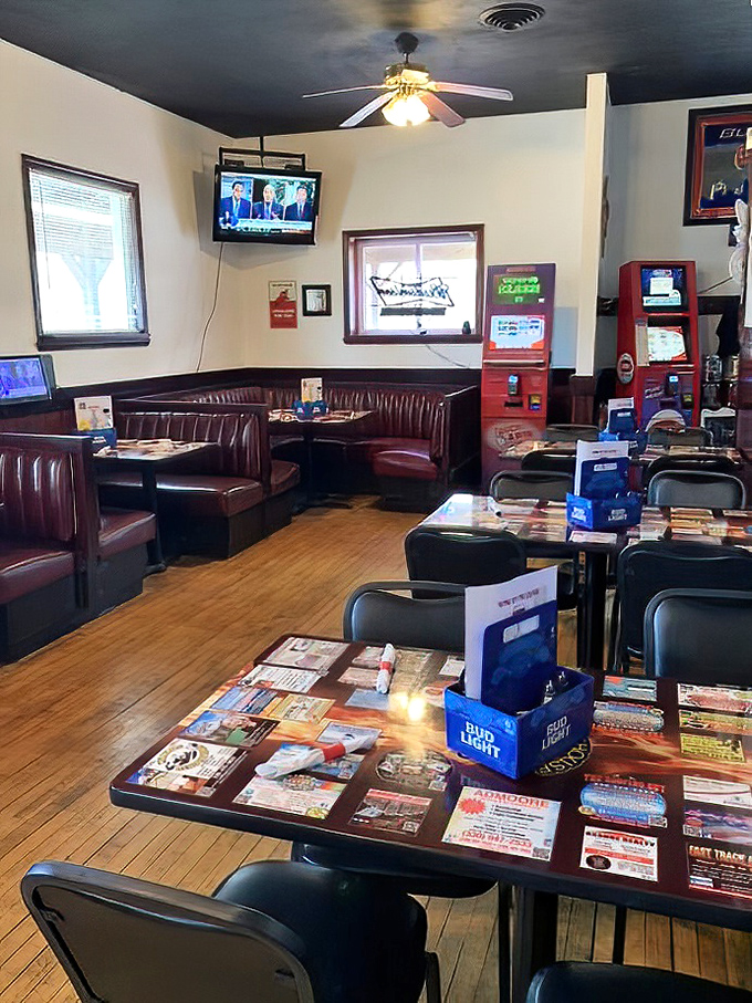 Cozy booths and wooden tables create that perfect "everybody knows your name" vibe, where comfort food meets comfortable seating in perfect harmony.