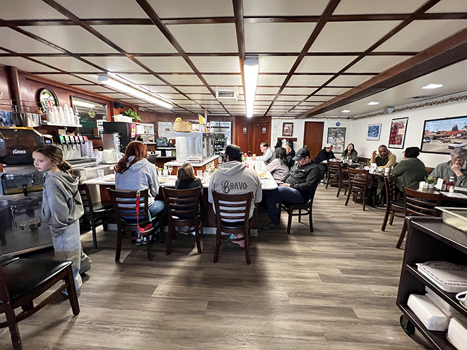 The warm wood tones and bustling atmosphere tell you everything: this is where locals gather for breakfast done right.