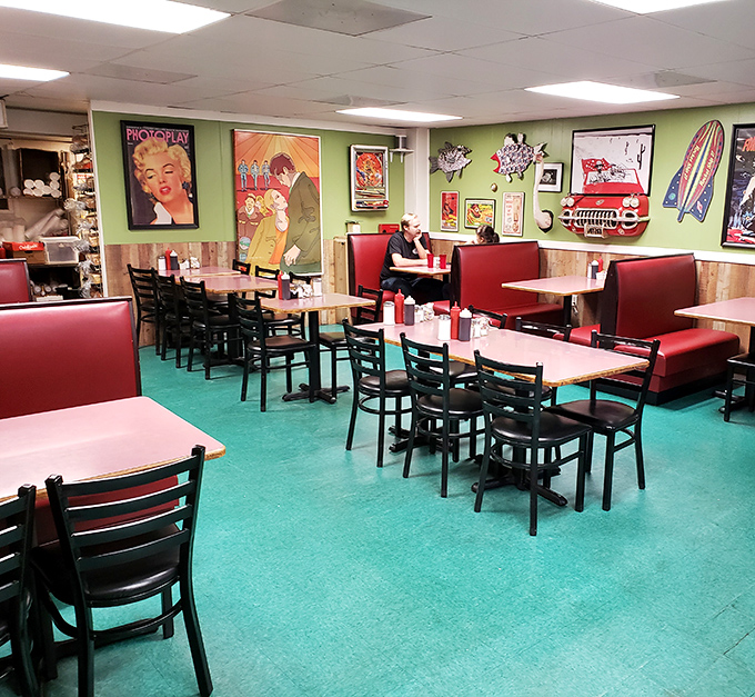 Step into a time capsule where bright colors, vintage posters, and red vinyl booths create the perfect breakfast atmosphere.