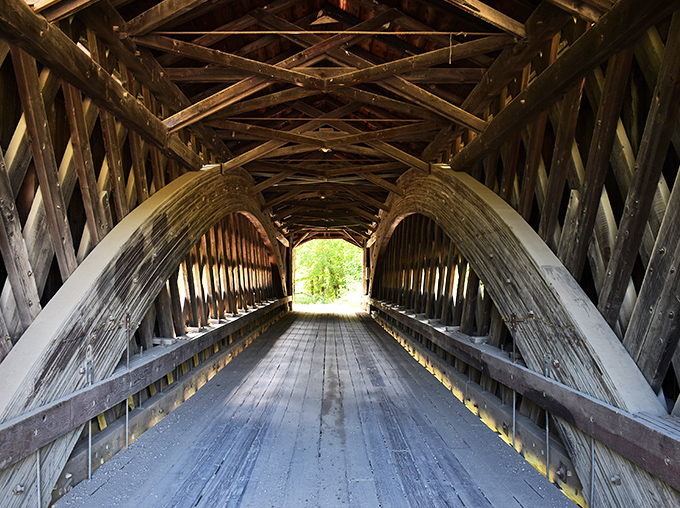 Step inside and you're transported to another era. The intricate lattice work creates a mesmerizing tunnel of craftsmanship rarely seen today.