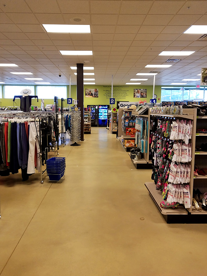 A wonderland of organized chaos awaits inside, where children's clothing hangs in colorful rows—each tiny garment a story waiting to be continued.