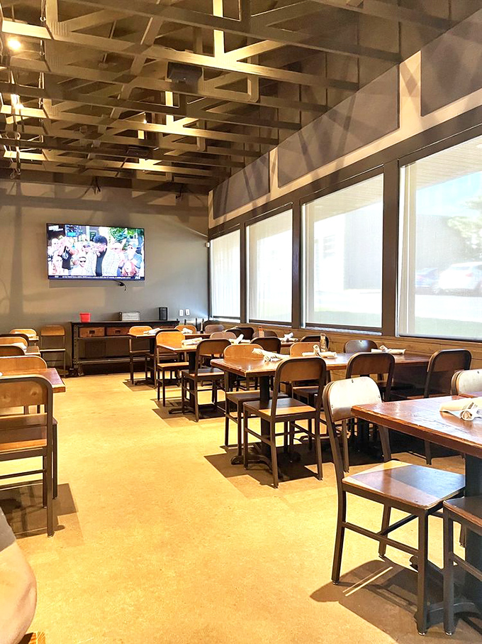 Inside, wooden tables and exposed beams create that perfect sweet spot between "fancy enough for date night" and "casual enough for sauce on your shirt."