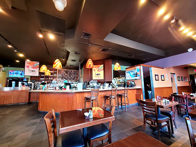 Warm wood tones and colorful pendant lights create that perfect "neighborhood joint" vibe&mdash;not too fancy, not too casual, just right for serious eating.