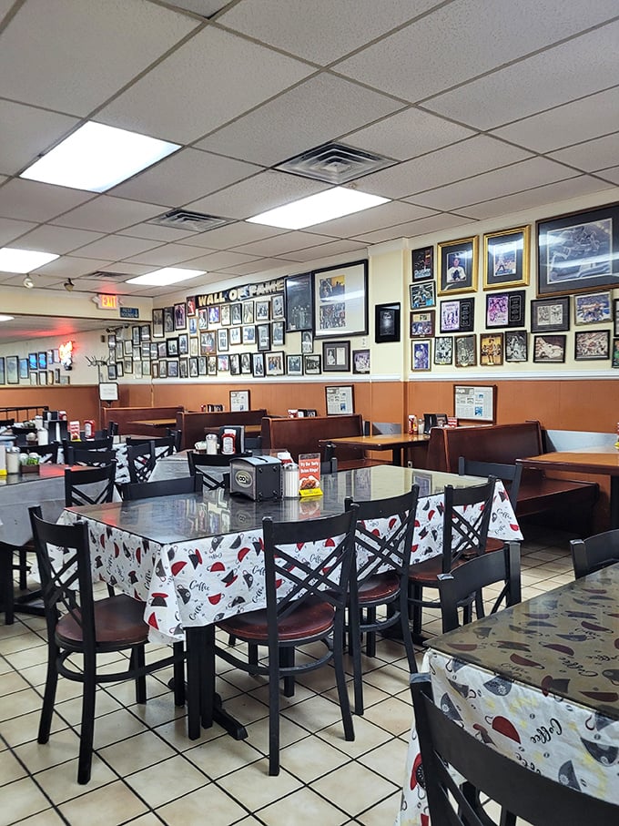 Wall-to-wall memories line the dining room, telling stories of satisfied customers and celebrity visits through decades of barbecue excellence.