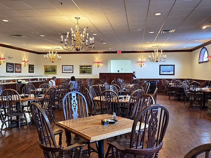 Elegant chandeliers illuminate wooden Windsor chairs where countless happy diners have loosened their belts after one too many helpings of legendary fried chicken.
